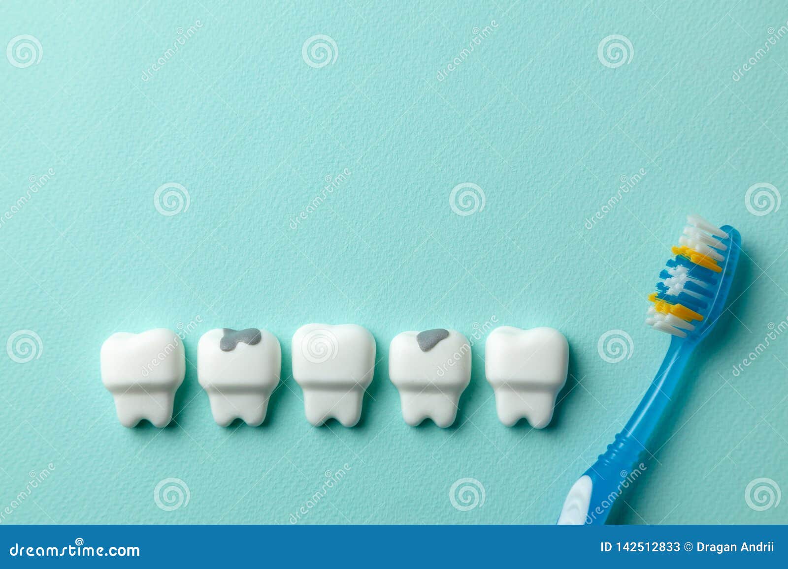 Healthy White Teeth and Tooth with Caries on Green Mint Background and ...
