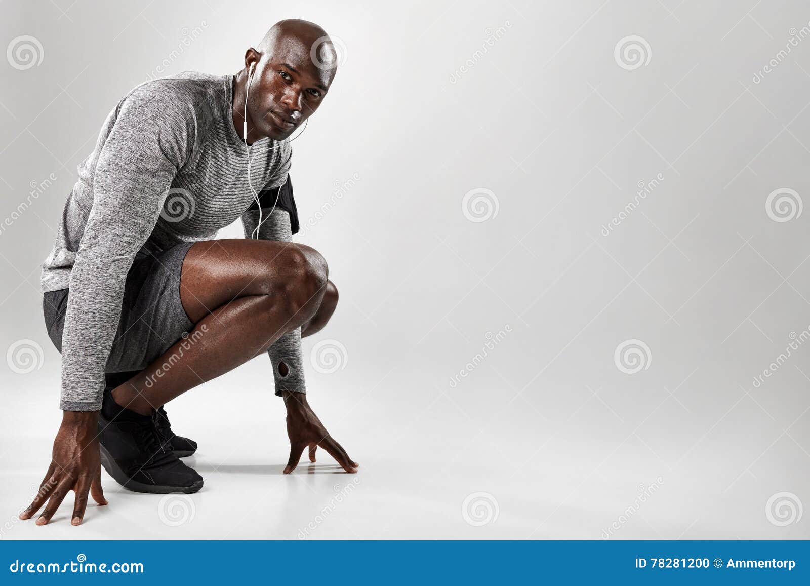 Healthy Young Black Man Kneeling on Grey Background Stock Photo - Image ...
