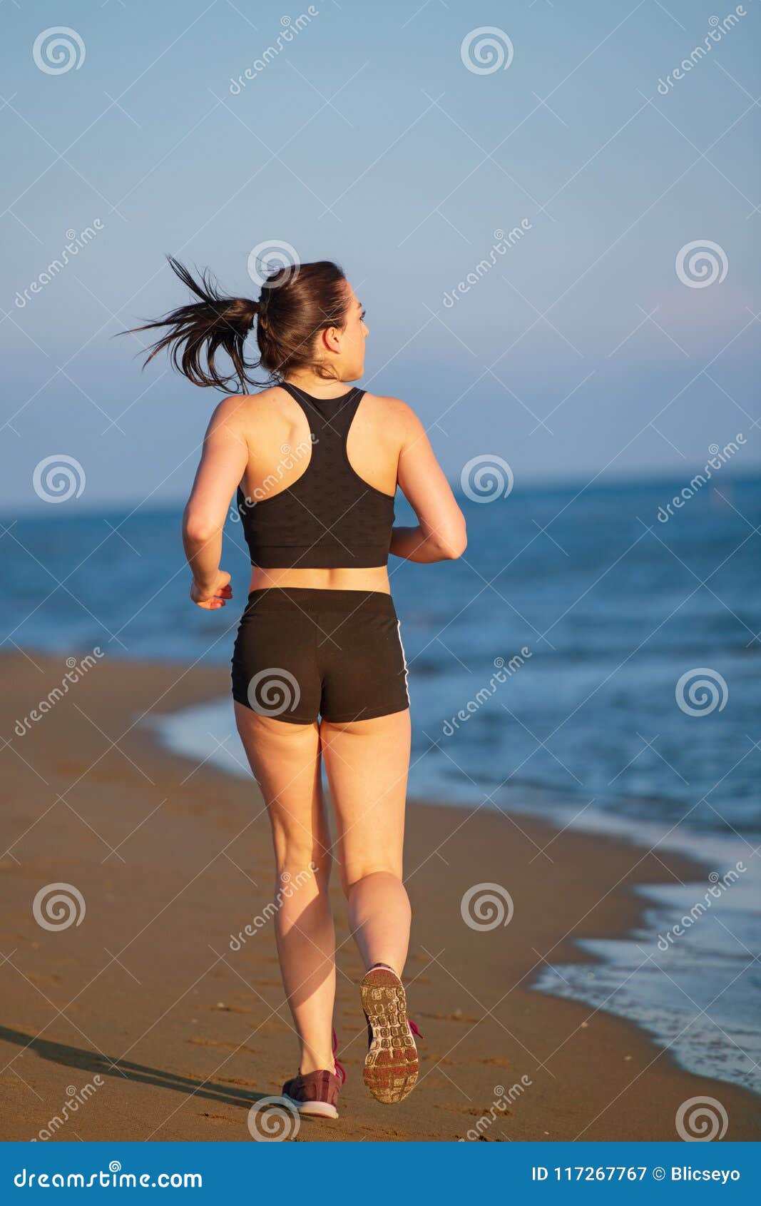 Healthy Young Fitness Woman Runner Running On Sunrise Seaside Tr Stock