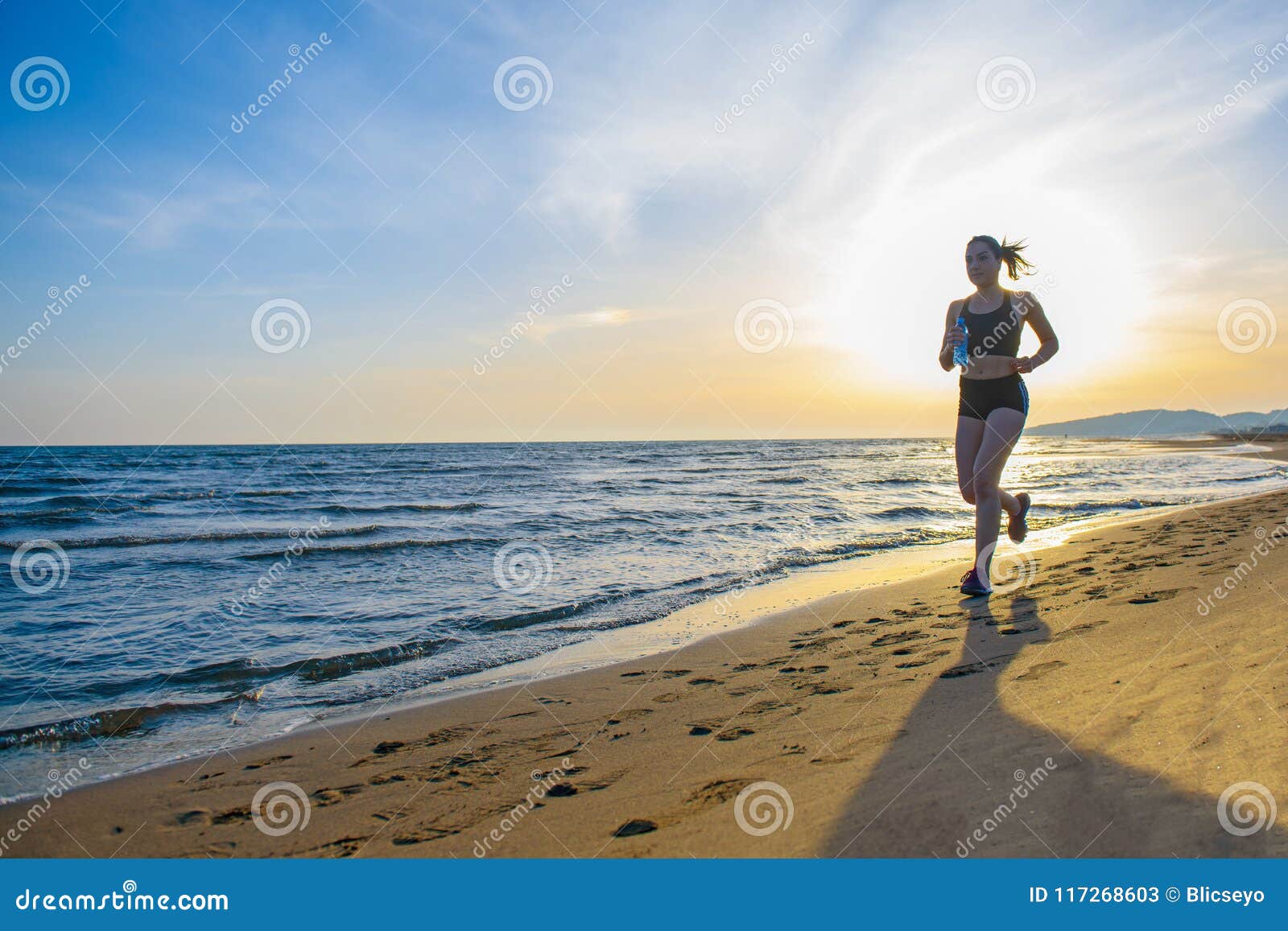 Healthy Young Fitness Woman Runner Running On Sunrise Seaside Tr Stock