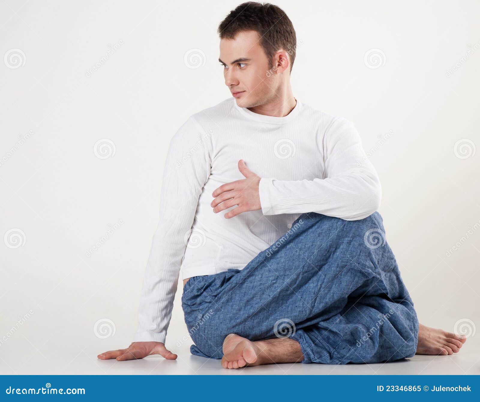 Healthy Young Man Doing Yoga. Spine Twisting Pose Stock Image - Image ...