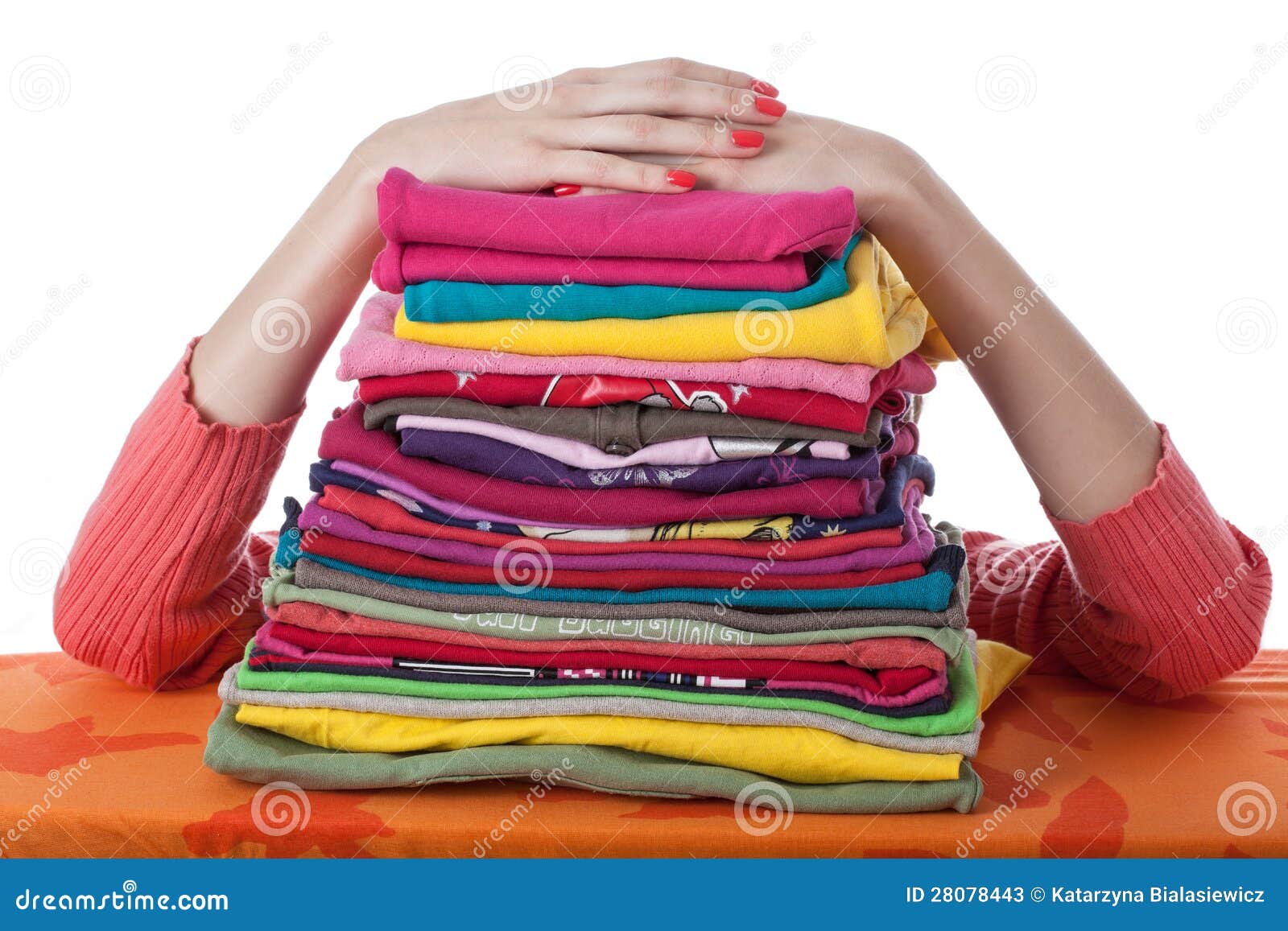 Heap of arranged clothes stock image. Image of hands - 28078443