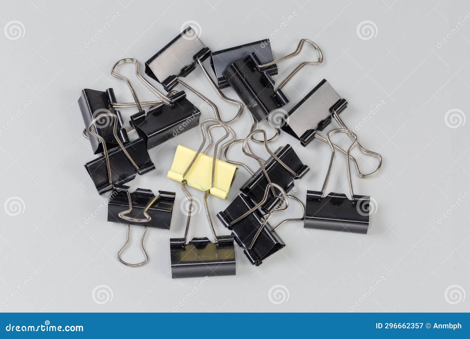 Heap of Black and One Yellow Binder Clips for Paper Stock Image - Image ...