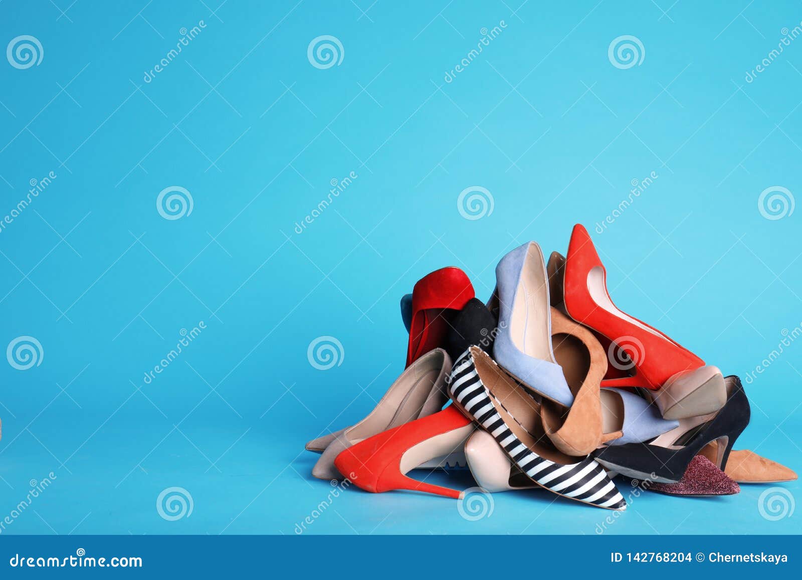 Heap of Different Shoes on Color Background Stock Photo - Image of ...