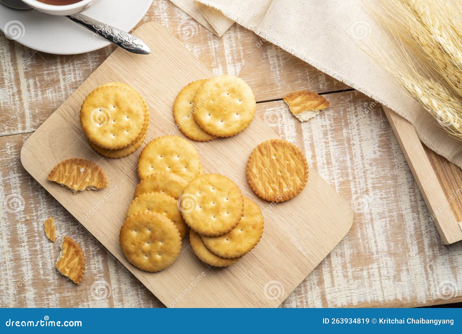 Heap of Dry Thin Crispy Crackers on Cutting Board on Wood Table. Stock ...