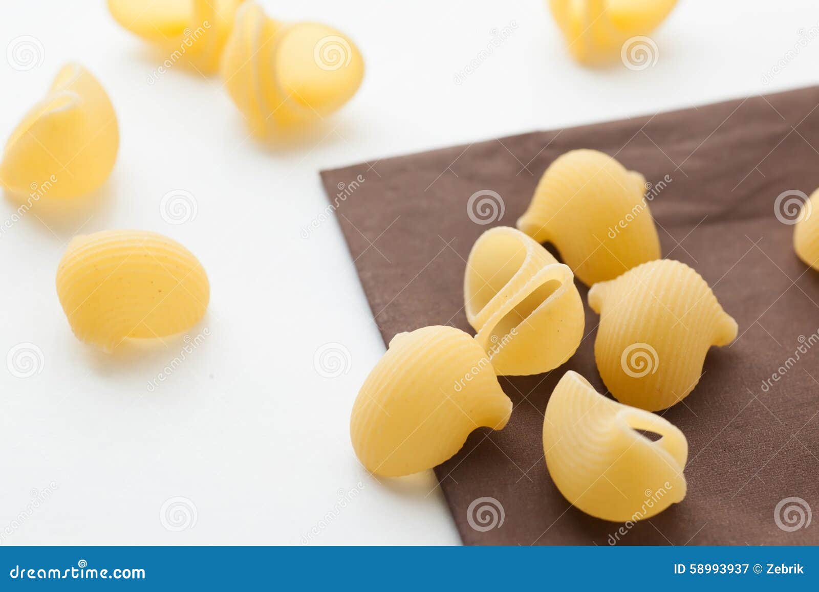 Heap of Macaroni Shells on Brown Napkin, Selective Focus. Stock Image ...