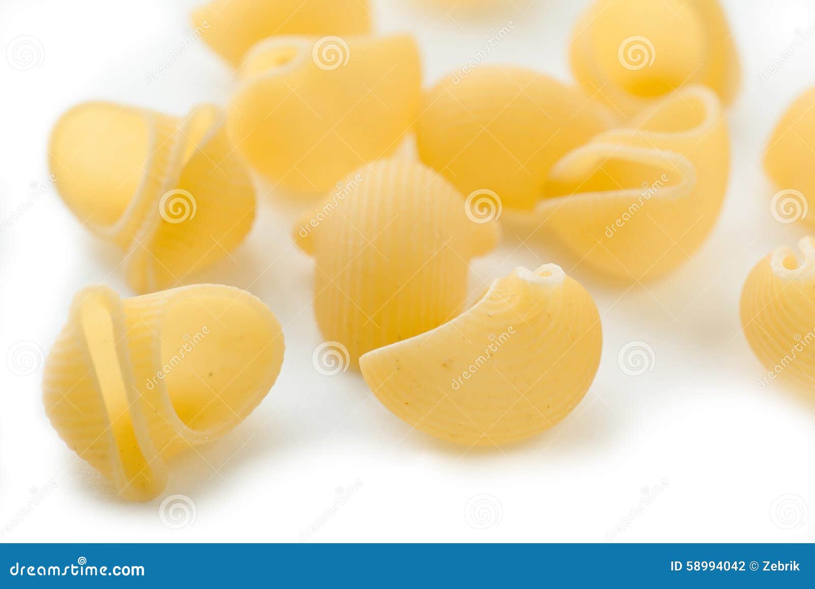 Heap of Raw Macaroni Shells, Selective Focus. Isolated on White Stock ...