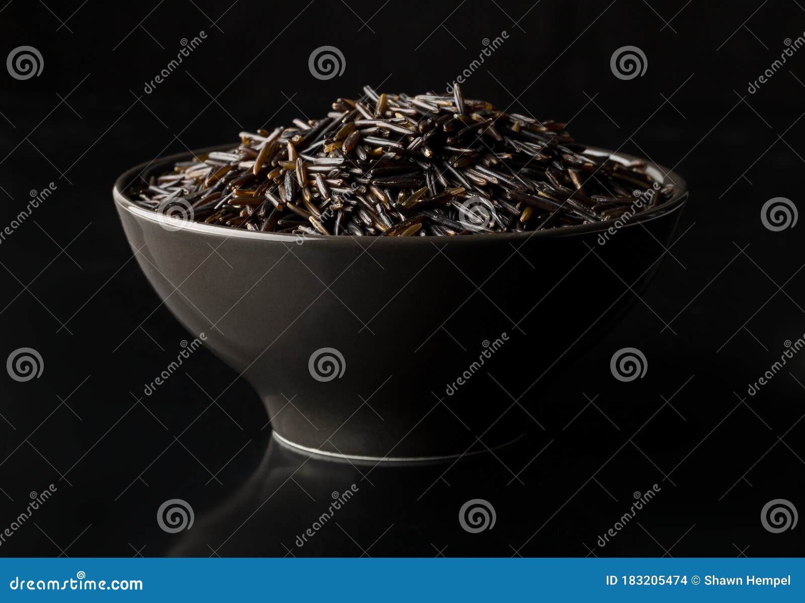 Heap of Uncooked, Raw, Black Wild Rice Grains in Black Bowl on Black ...