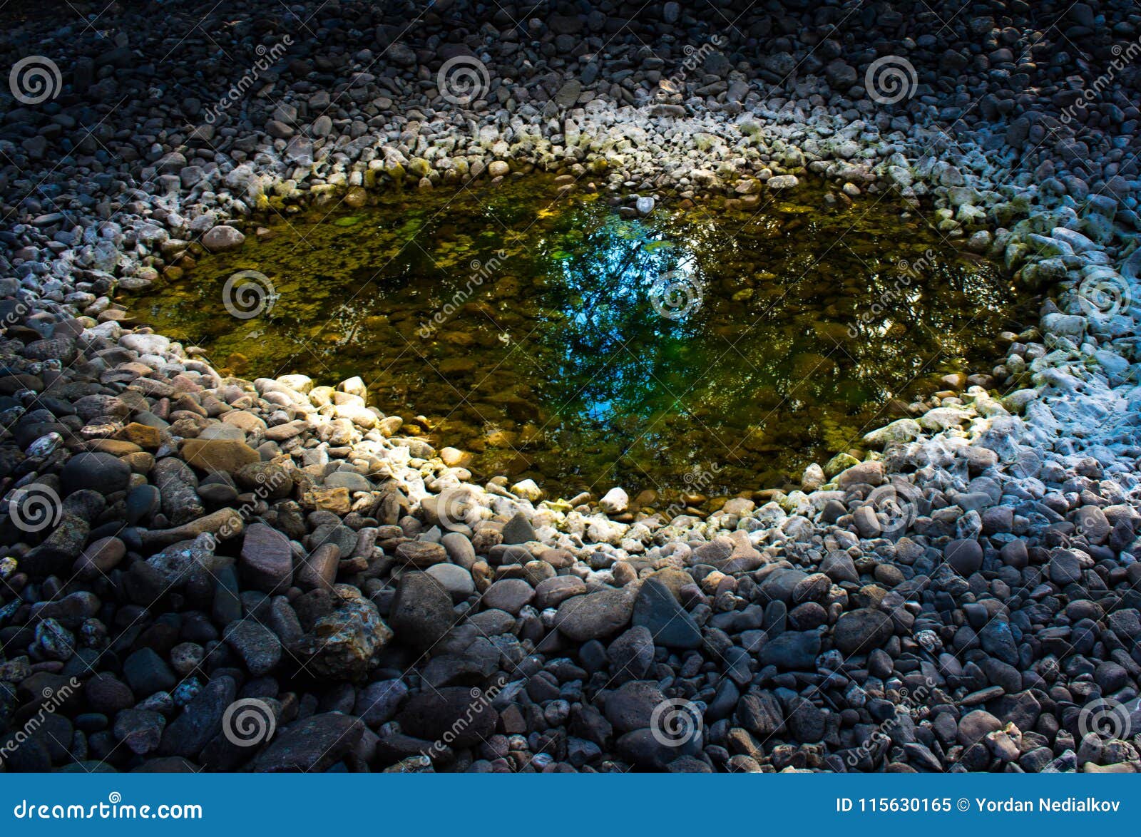 Hear shaped pebble puddle stock image. Image of rain - 115630165