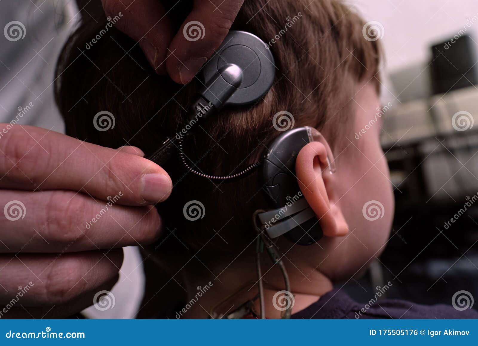 Hearing Aid in Boy`s Ear stock photo. Image of hand - 175505176