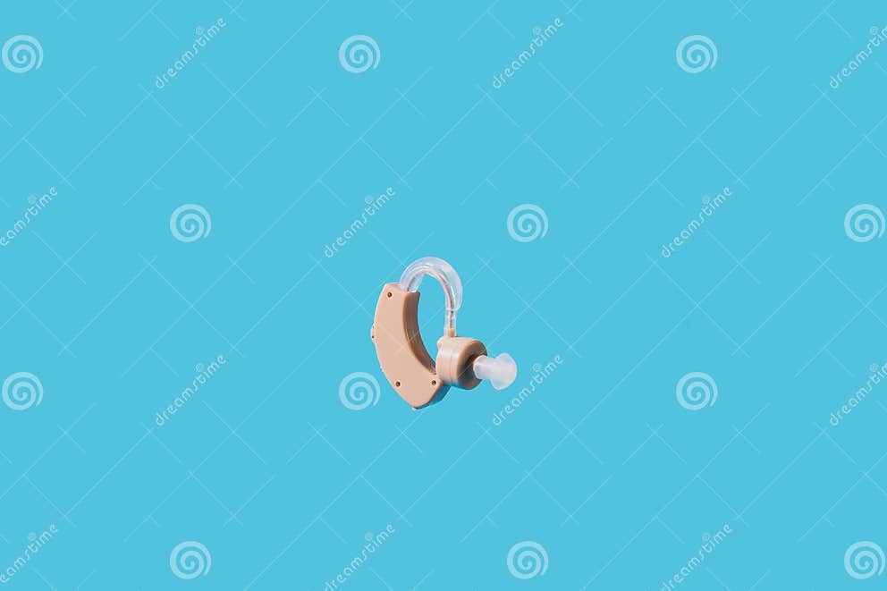 Hearing Aid Flies Against a Blue Background Stock Image - Image of ...