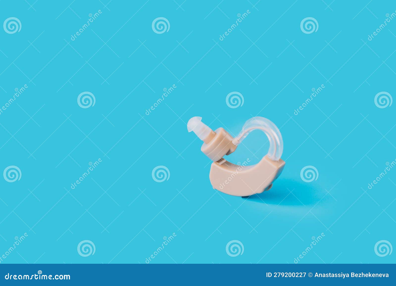 Hearing Aid in the Middle of a Blue Background Stock Image - Image of ...