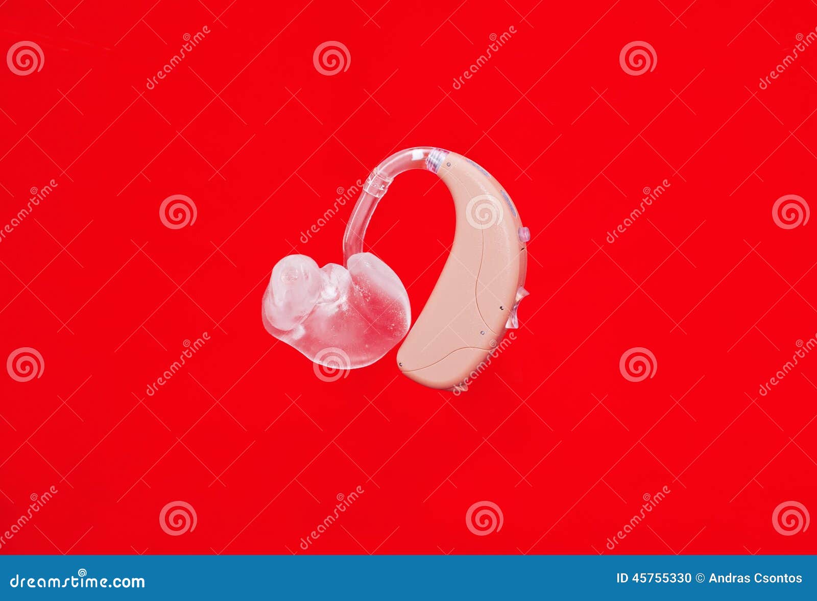 Hearing aid on red stock photo. Image of audiology, deafness - 45755330