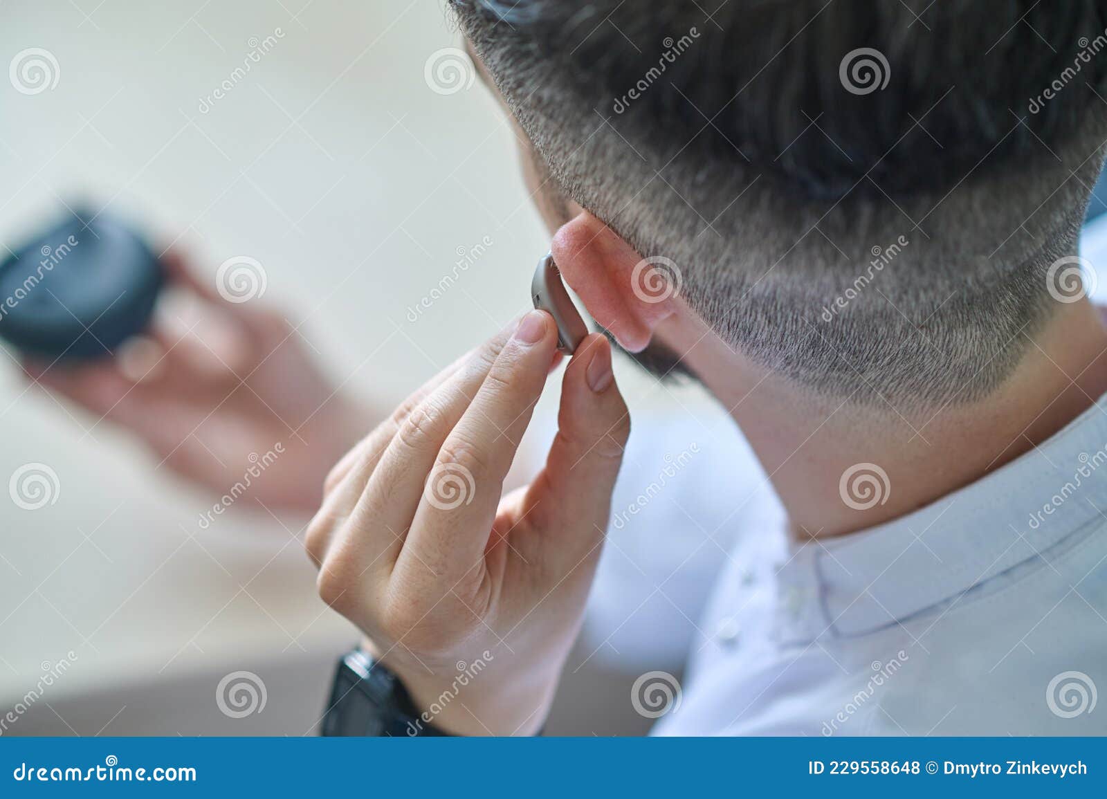 Doctor Testing Hearing Aid in His Ear Stock Photo - Image of specialist ...
