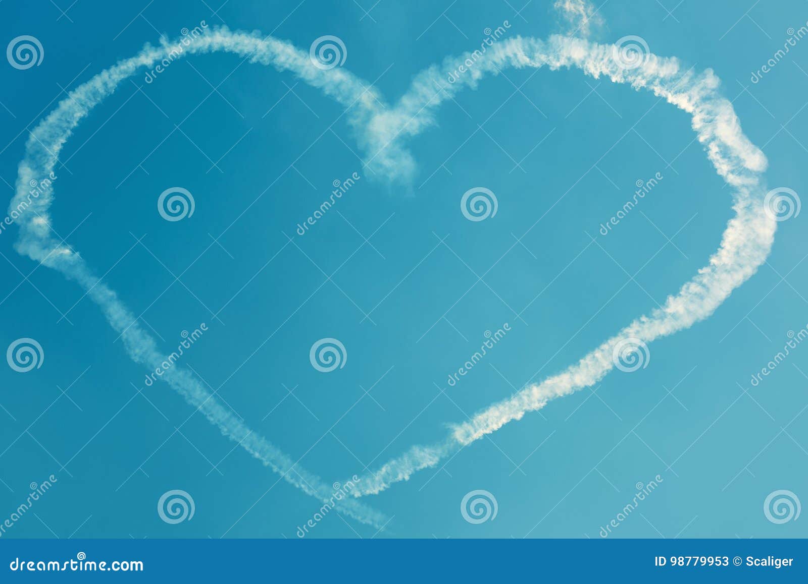 A Heart in the Blue Sky from Planes Stock Image - Image of stunt ...