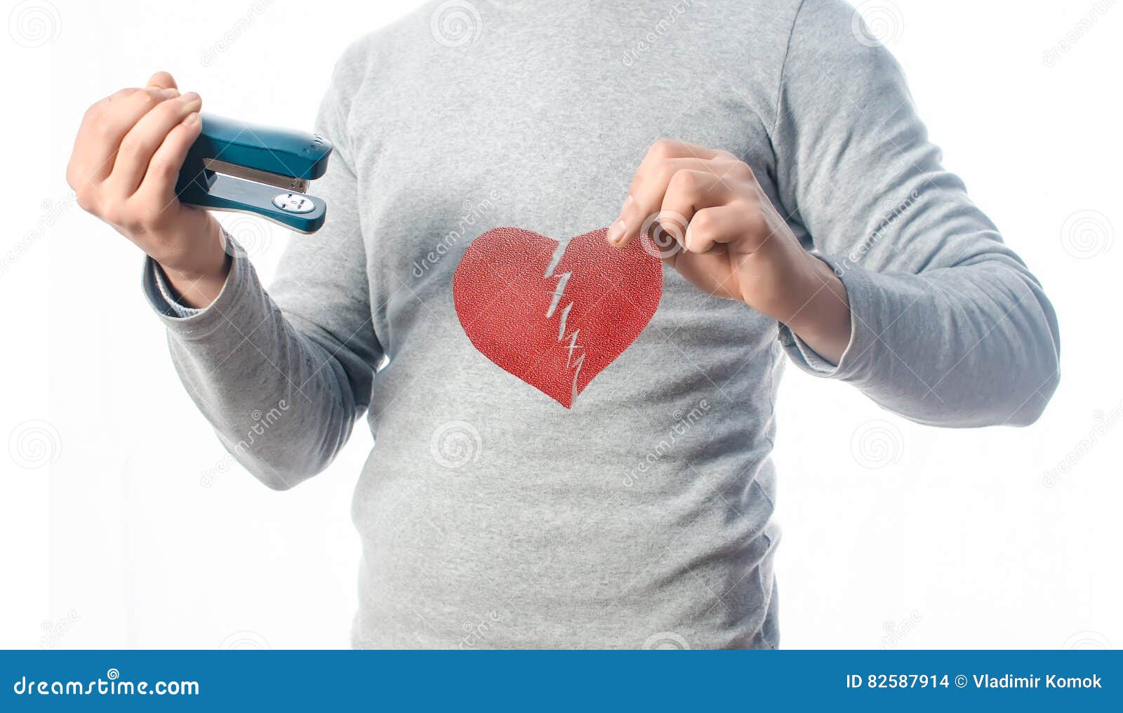 Heart clips in his hands stock photo. Image of love, help - 82587914