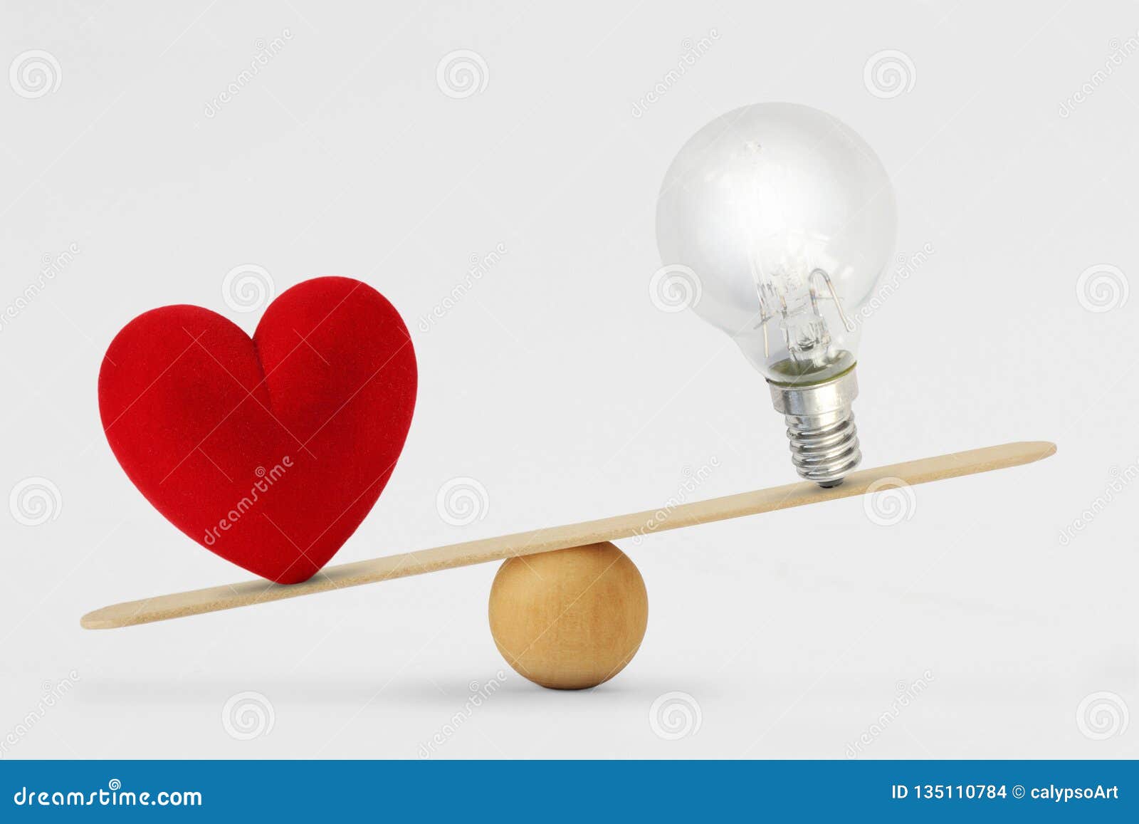 Heart and Light Bulb on Scale - Concept of Love Priority Over Brain in ...