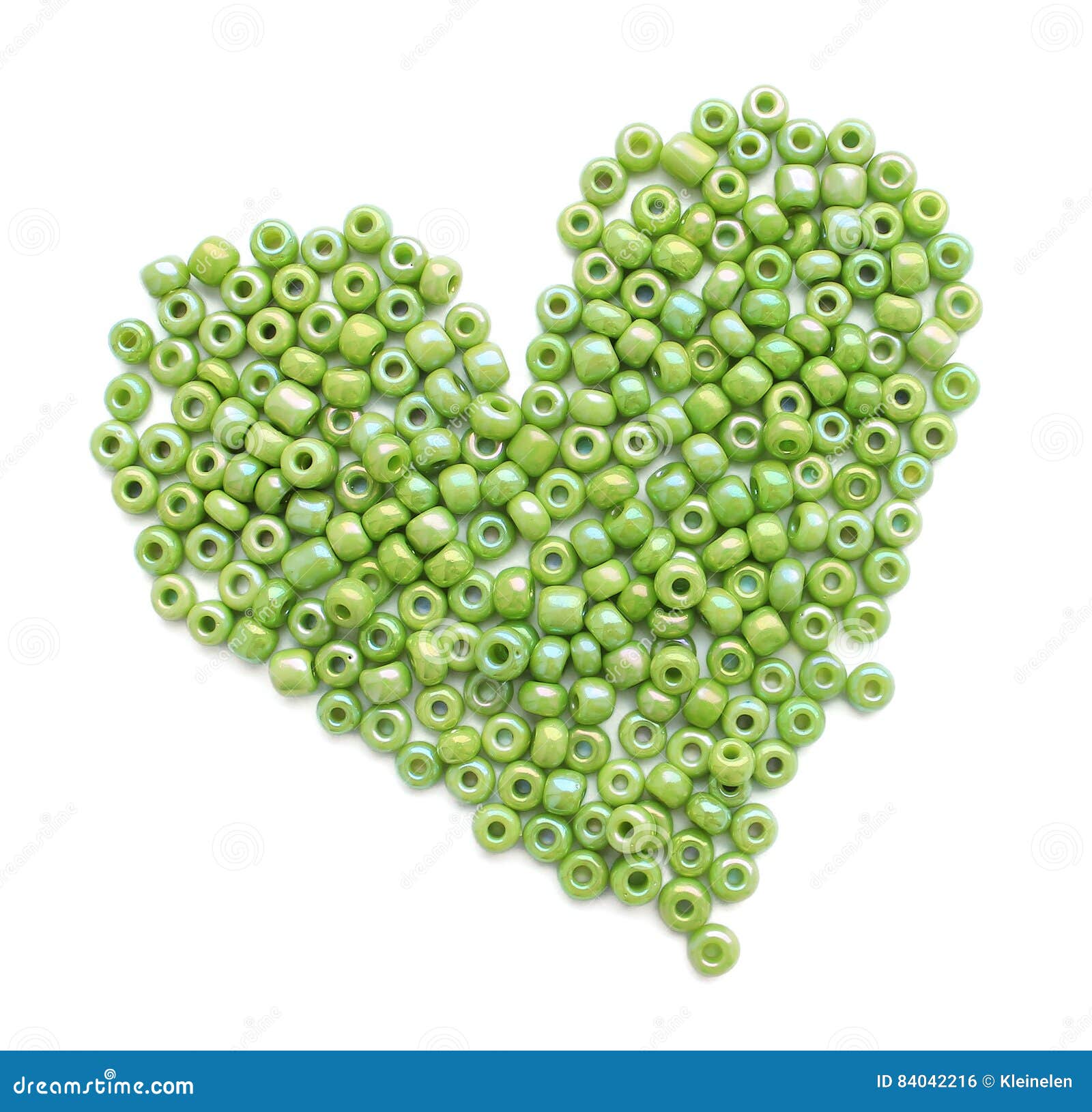 Heart made of green beeds stock photo. Image of plastic - 84042216