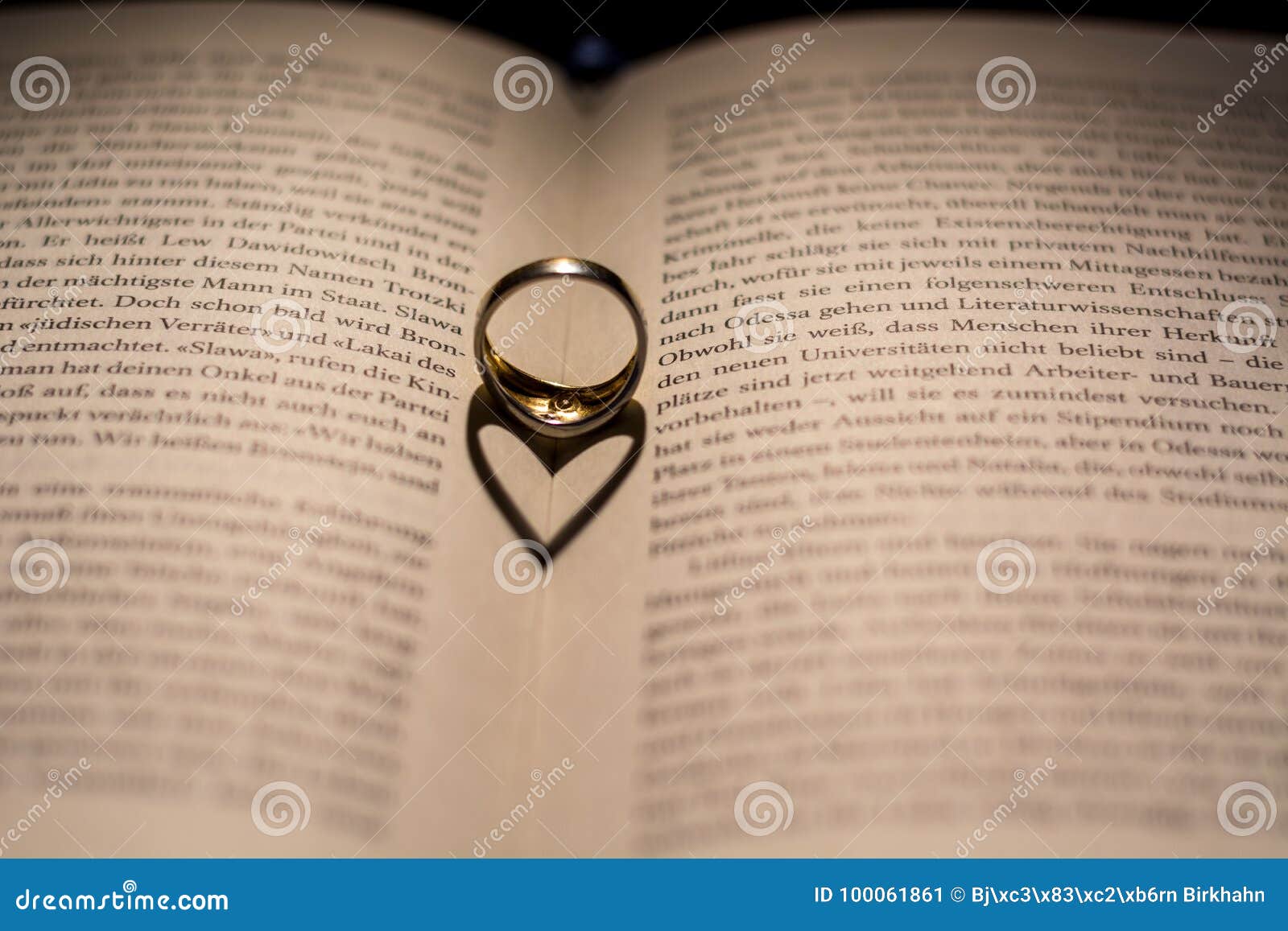 A Heart Made from the Shadow of a Ring on a Book Stock Image - Image of ...