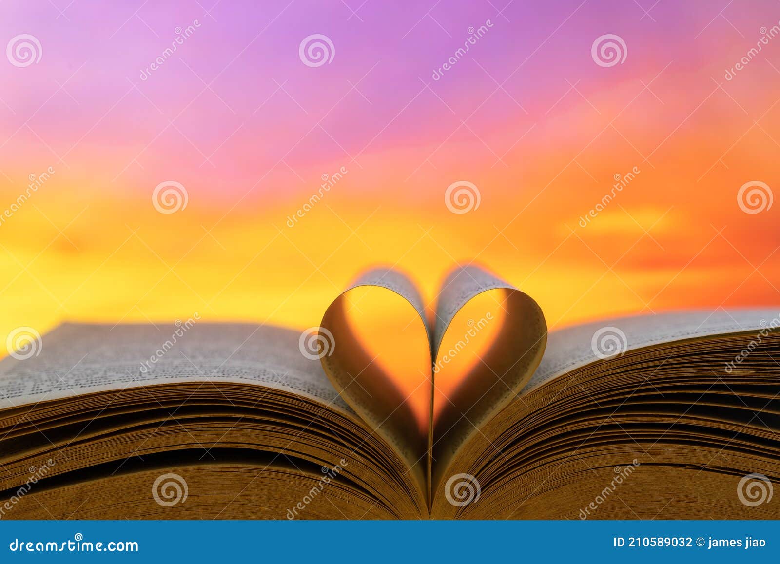 Heart from a Old Book Page Against a Beautiful Sunset Stock Photo ...
