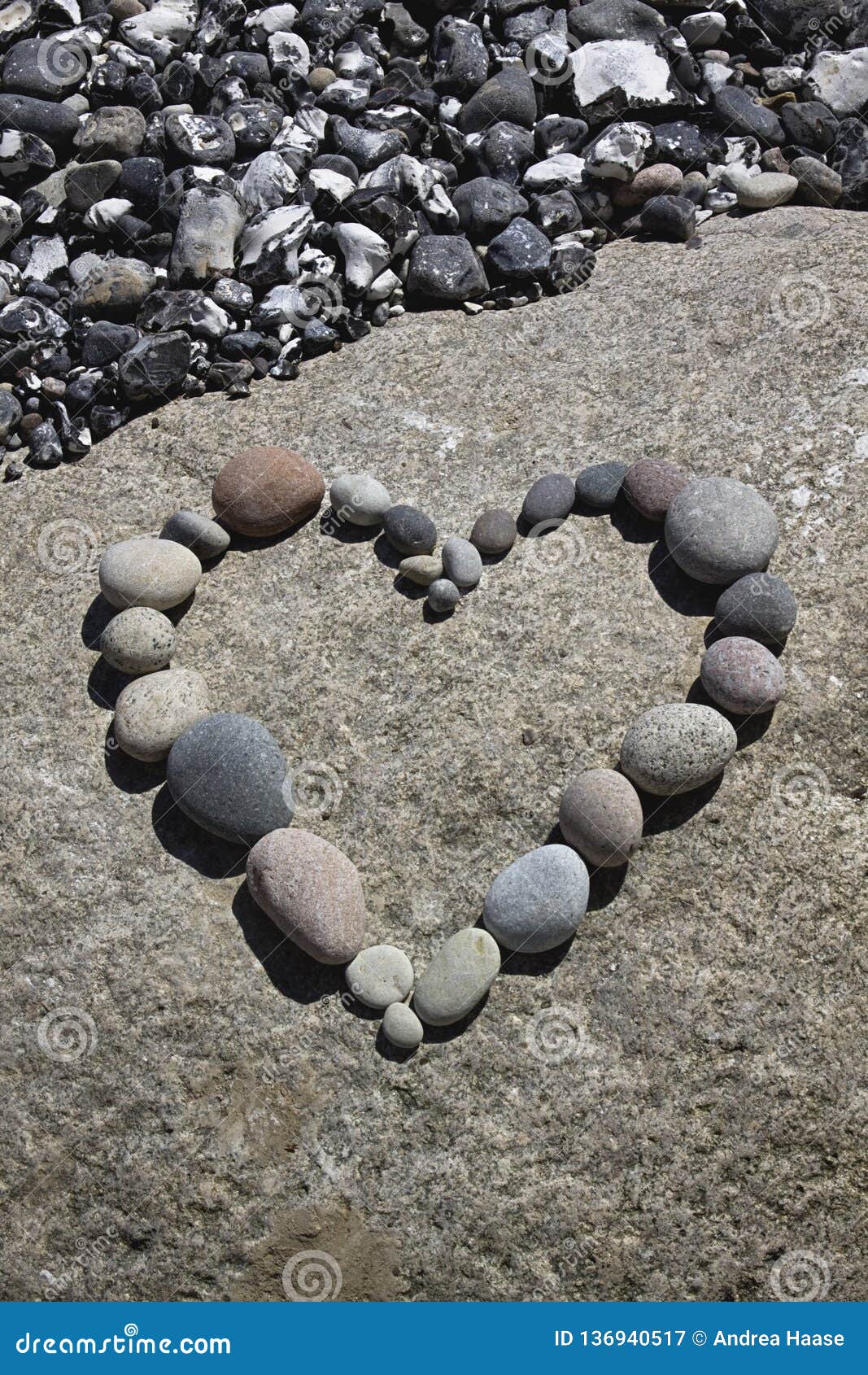 Heart of Pebble on a rock stock image. Image of beige - 136940517