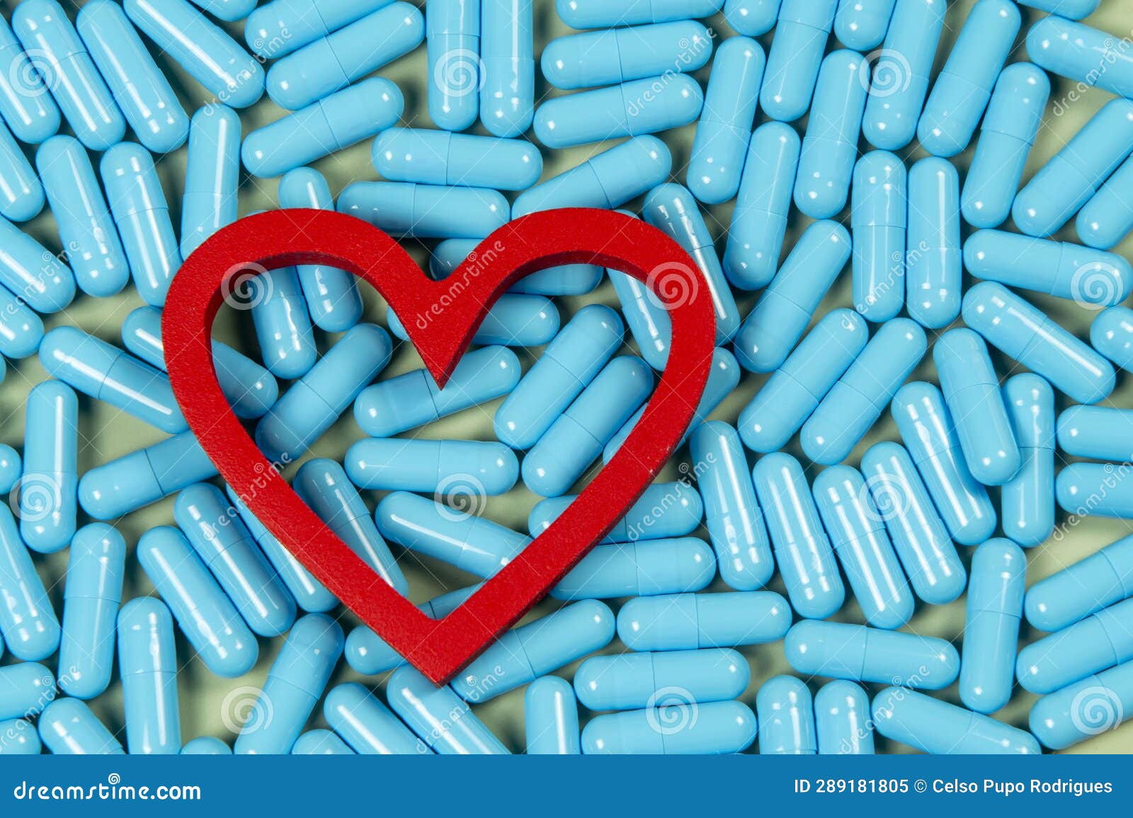 Heart Shape and Blue Capsules. Importance of Medication Treatment Stock ...