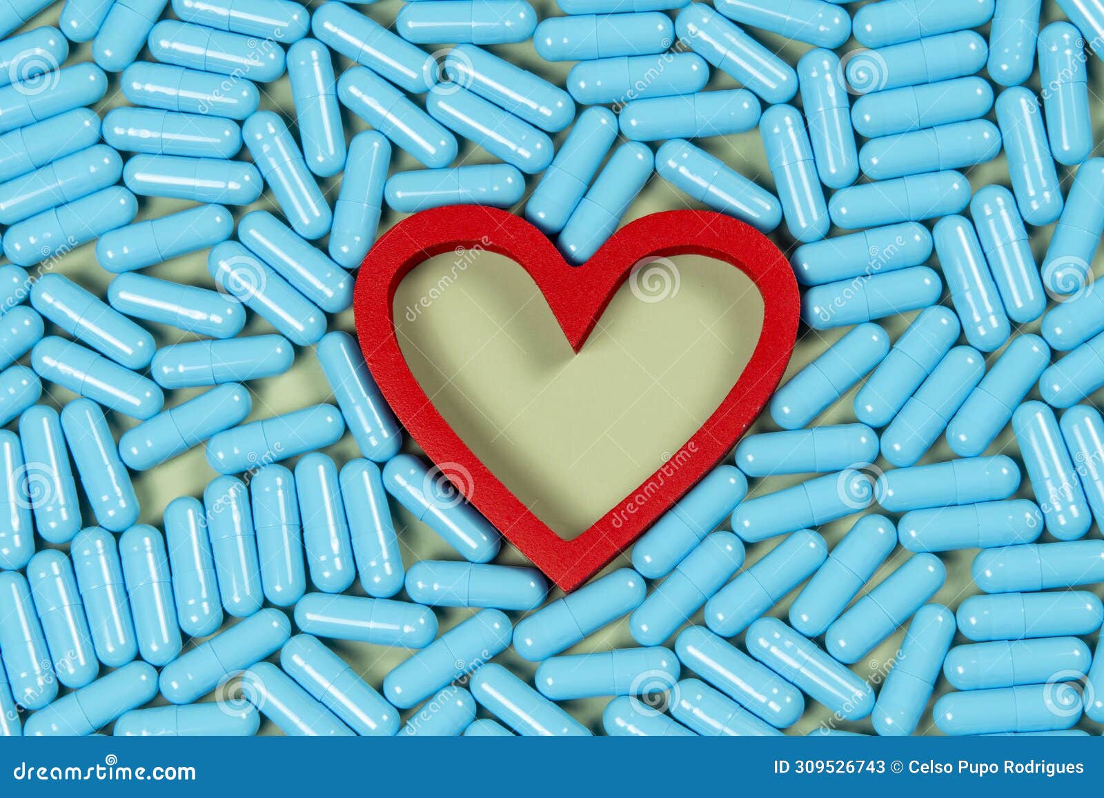 Heart Shape and Blue Capsules. Importance of Medication Treatment Stock ...