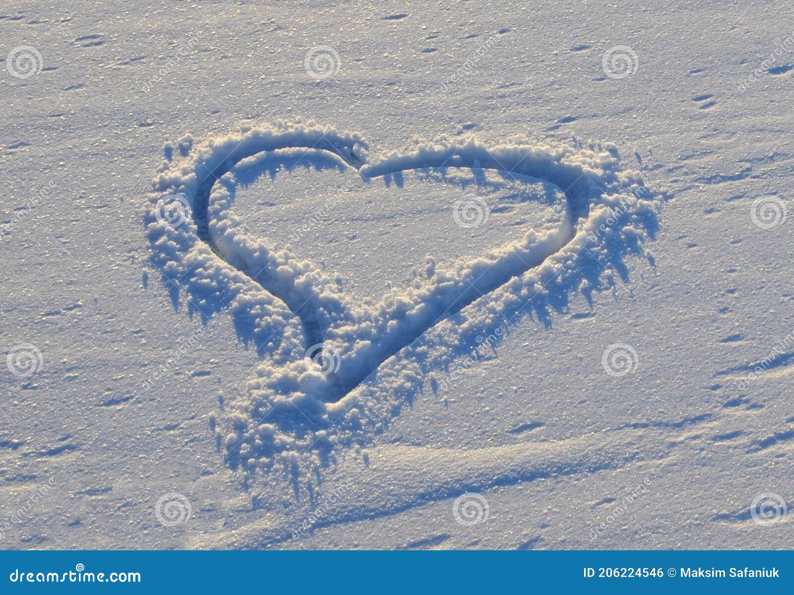 Heart Shape Drawn on a Snow Background. Love Concept Stock Photo ...