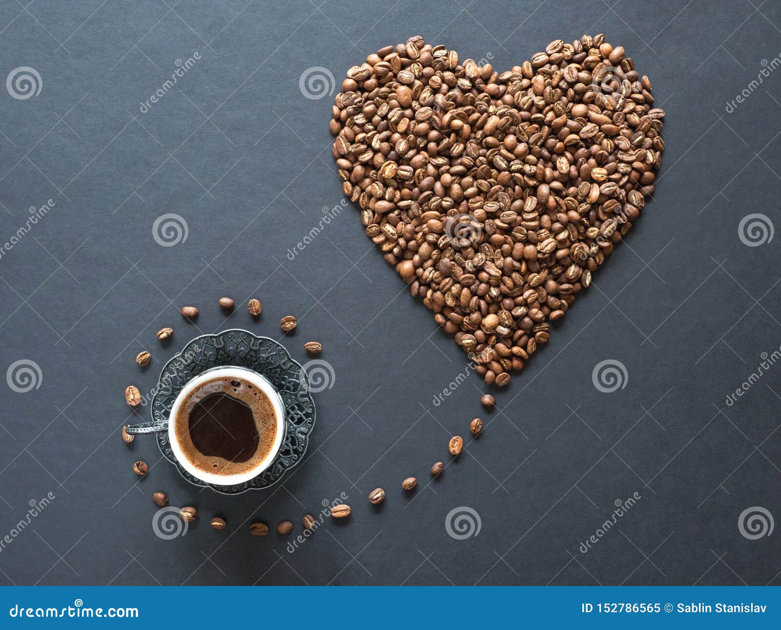 Heart Shape Made of Coffee Beans and a Cup of Black Coffee on Black ...
