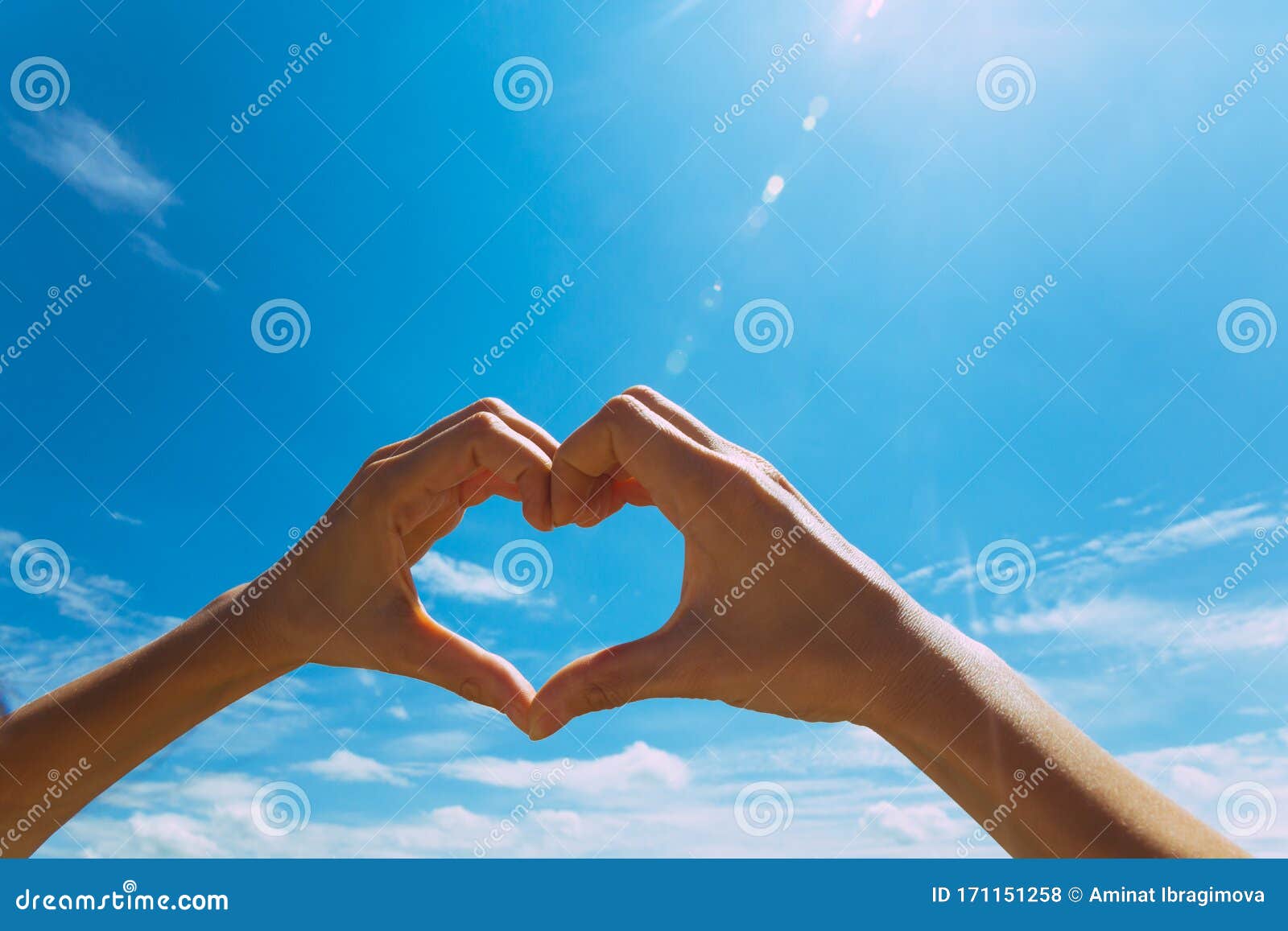 Heart Shape Making of Hands Against Blue Sky Hands Woman Stock Photo ...