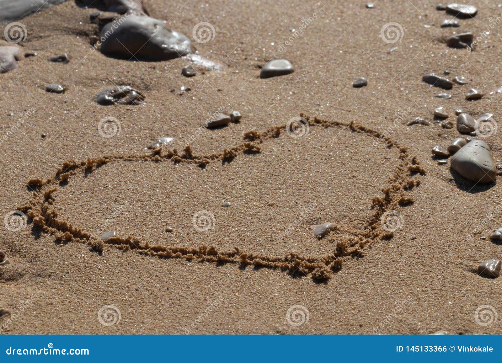 Heart shape in the sand stock photo. Image of nature - 145133366