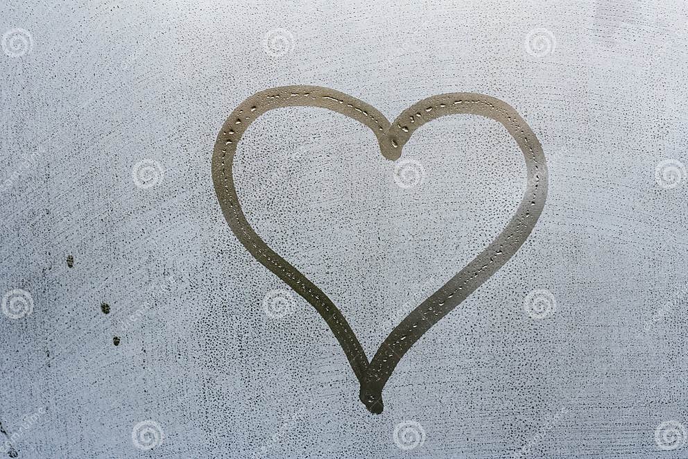 Heart shape on window stock image. Image of pane, condensation - 12211537