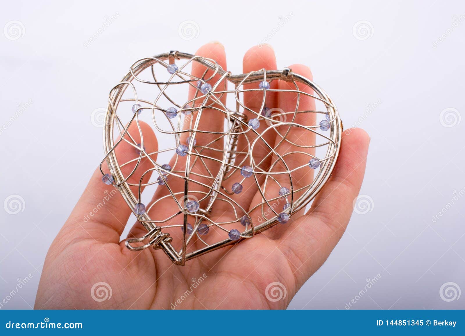 Heart shaped cage in hand stock image. Image of truelove - 144851345