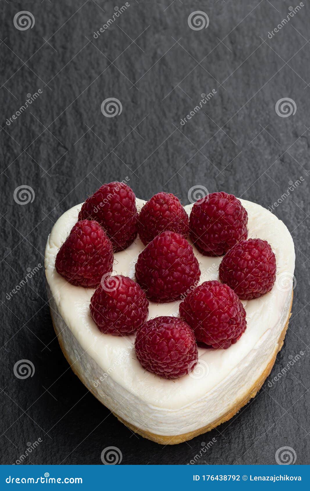Heart Shaped Cheesecake with Raspberry on Black Stone Background. Top ...