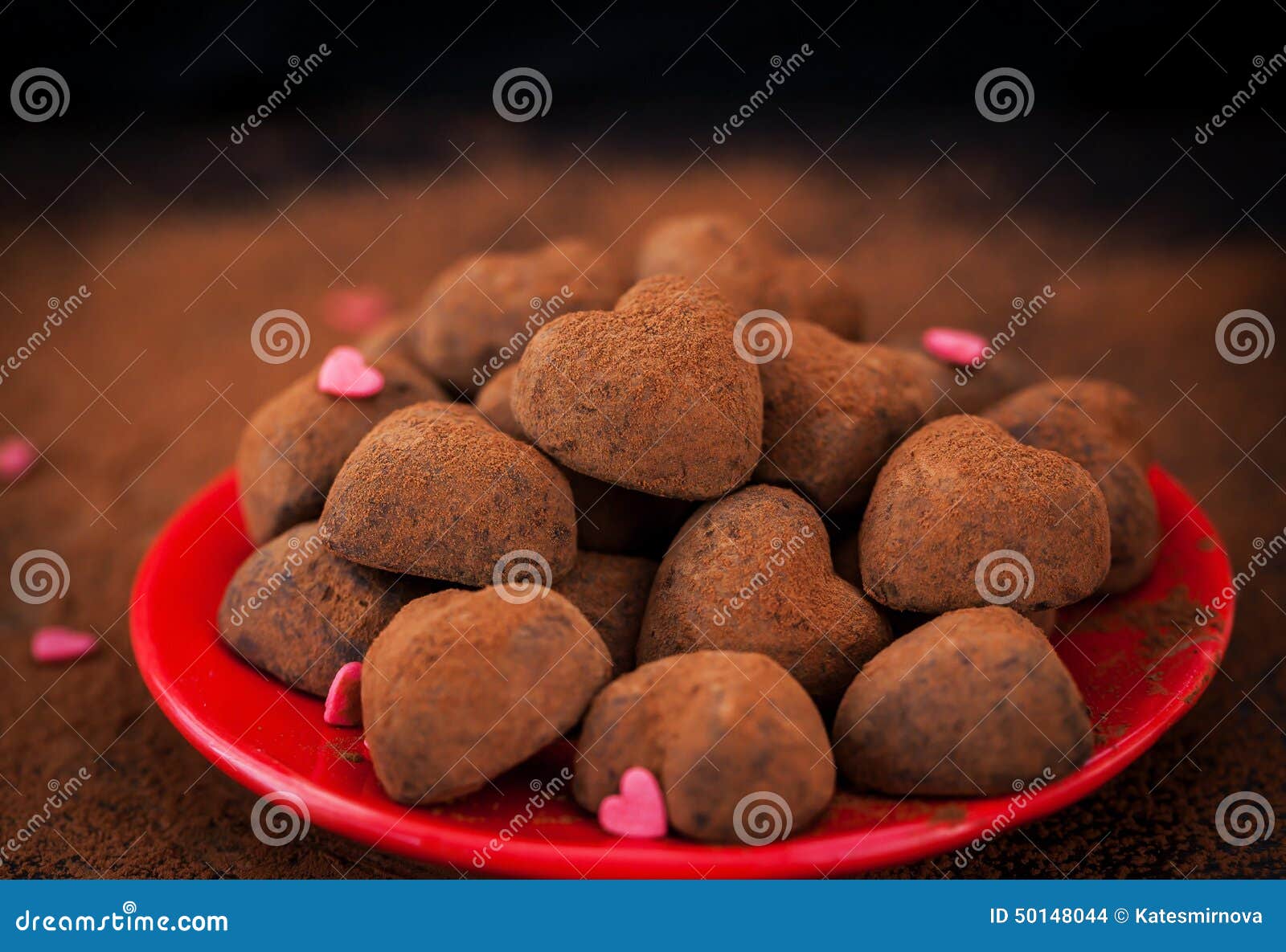 Heart Shaped Chocolate Truffles on Red Plate Stock Photo - Image of ...