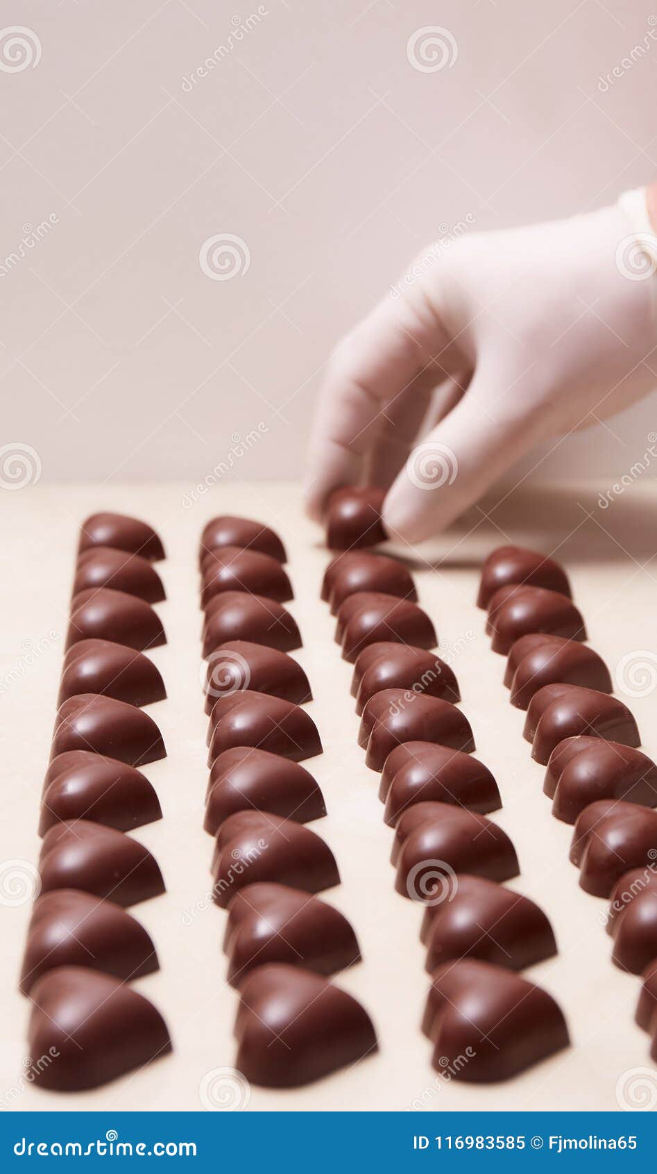 Heart-shaped Chocolates Being Ordered by a Gloved Hand Stock Image ...