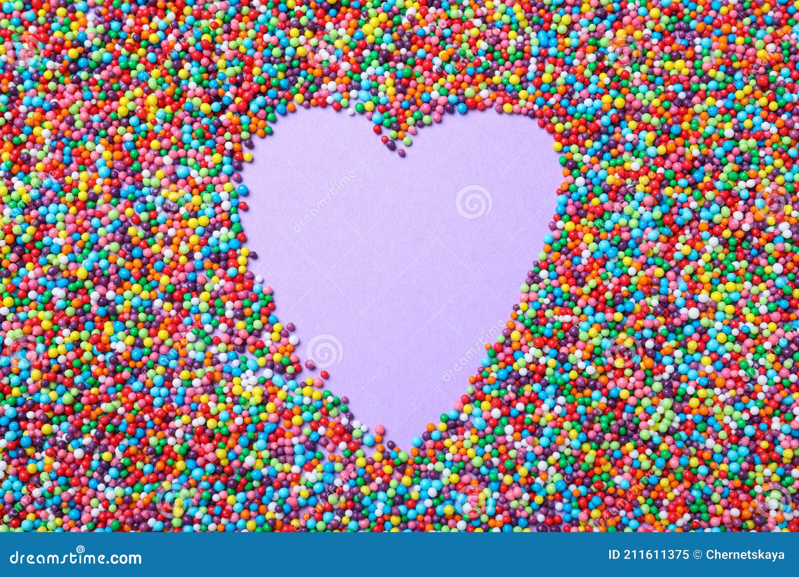 Heart Shaped Frame of Sprinkles on Lilac Background, Flat Lay with ...