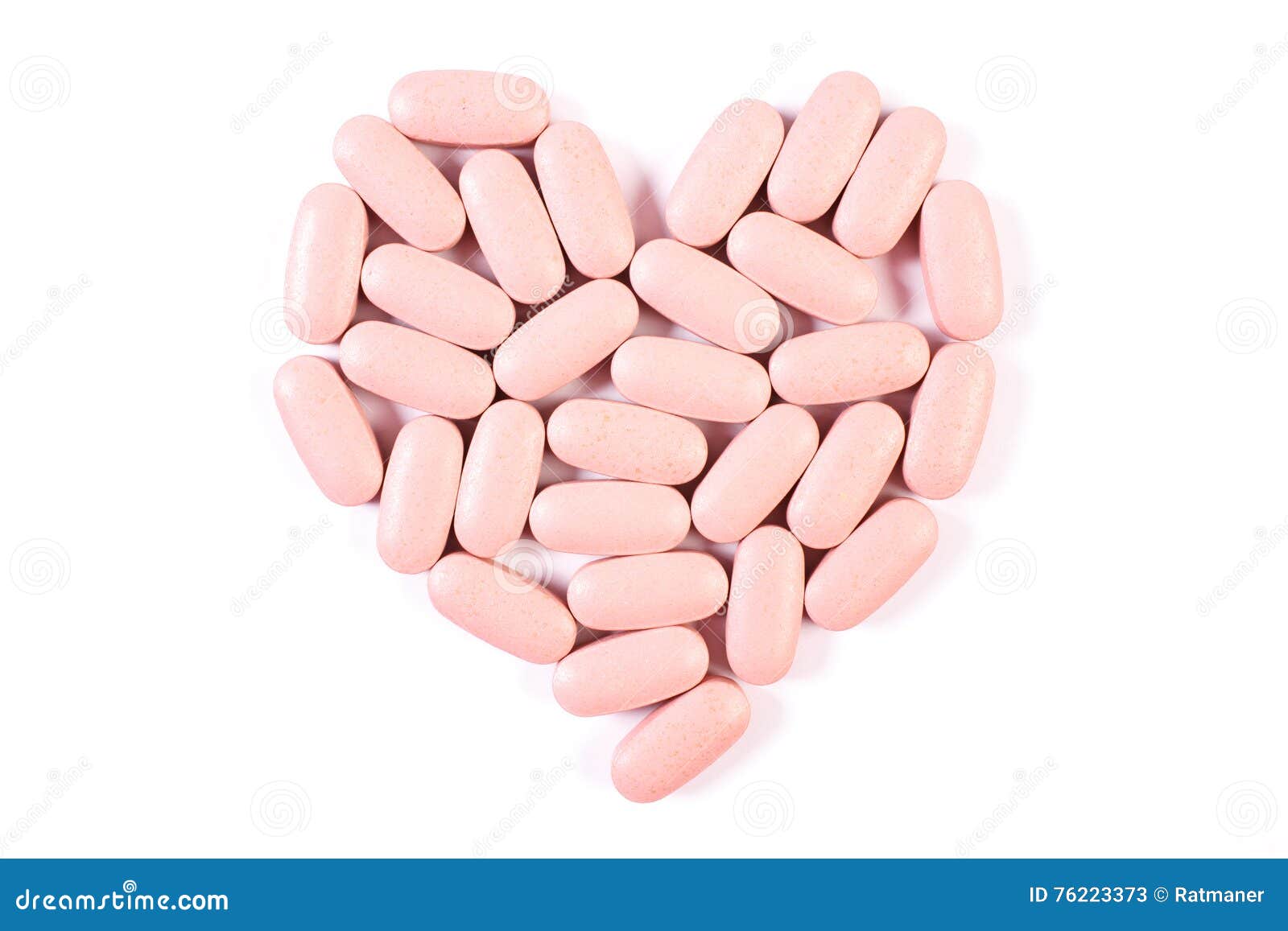 Heart Shaped Medical Pills And Capsules On White Background Health