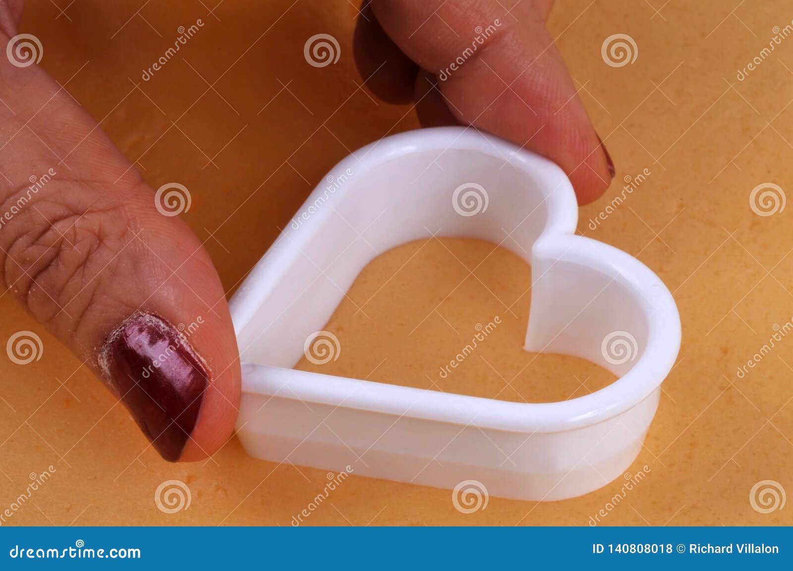 Heart Shaped Plastic Cookie Cutter Stock Photo - Image of finger ...