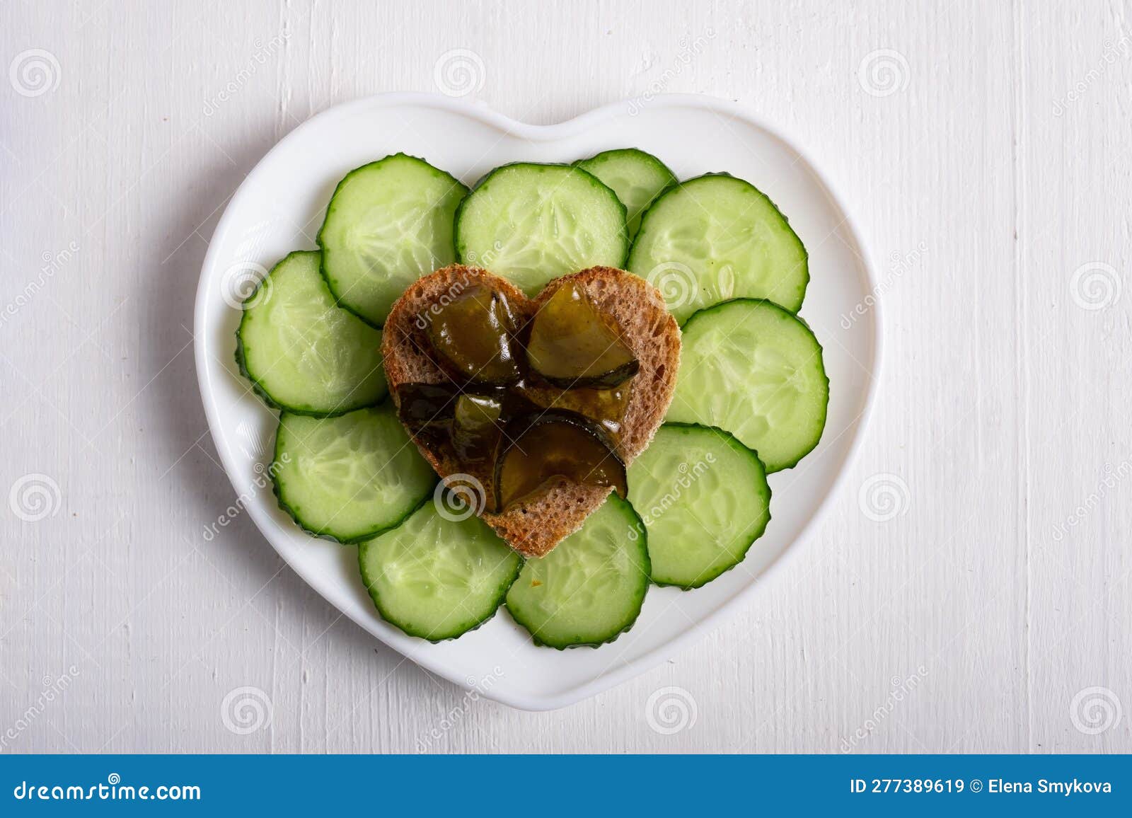 On a Heart-shaped Plate There is a Cucumber Cut into Circles and Heart ...