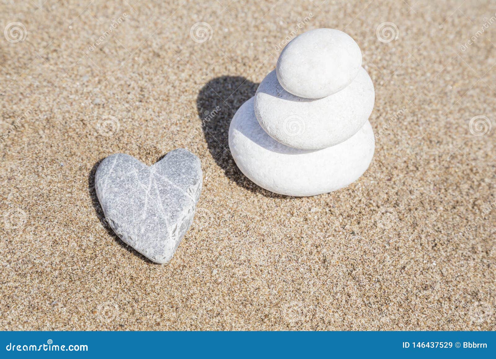 Heart Shaped Stone and Stack of Pebbles on Balance on Sand Stock Image ...