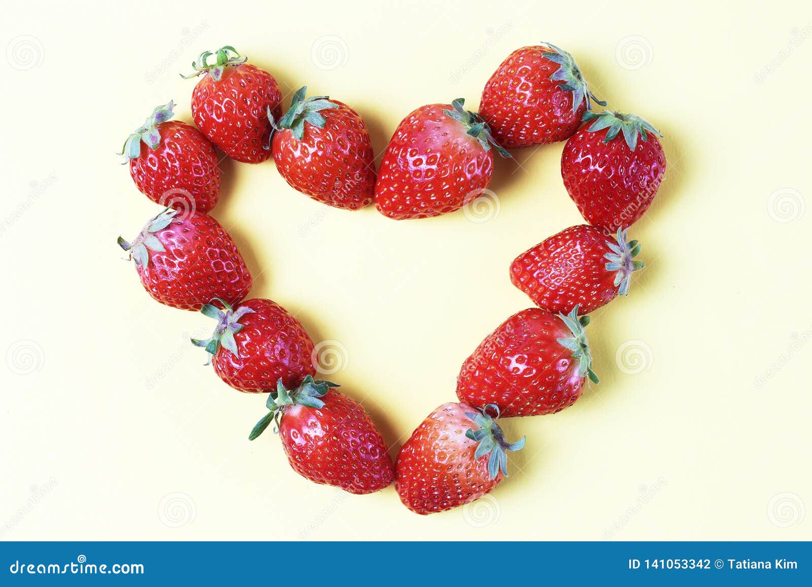 Heart Shaped Strawberries On A Yellow Background, Flat Lay Stock Photo ...