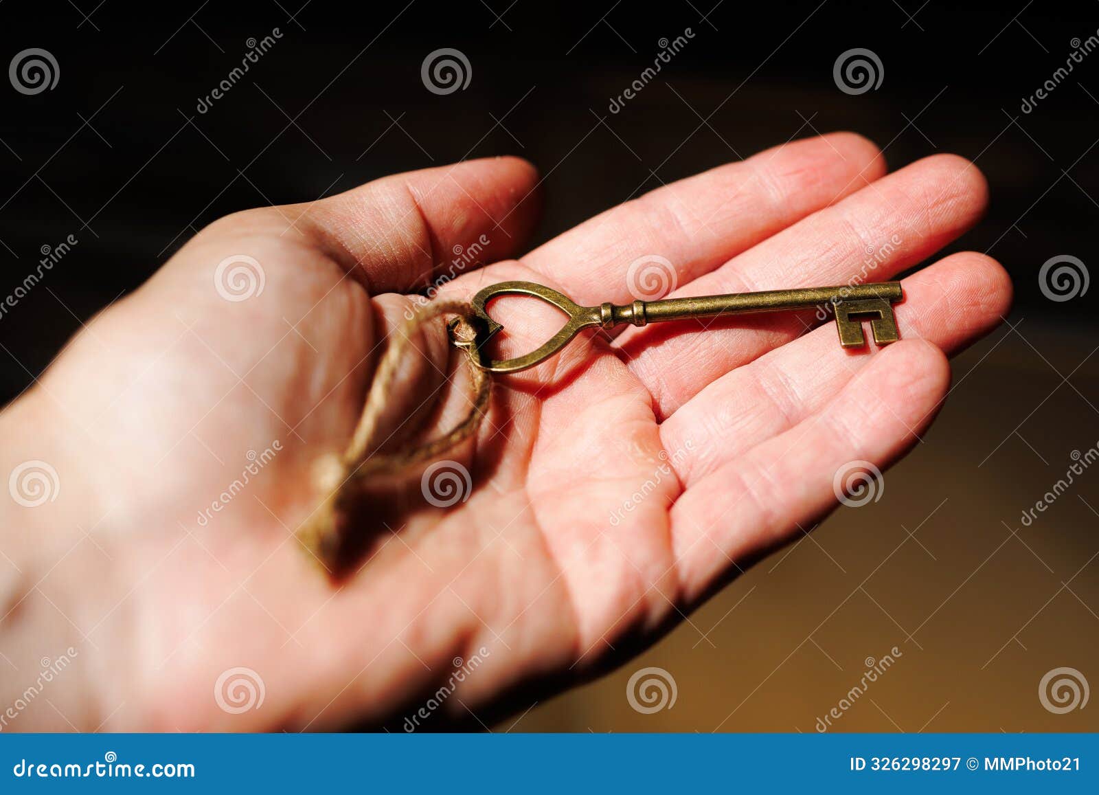 Heart Shaped Vintage Skeleton Key in Hand on Dark Background Stock ...