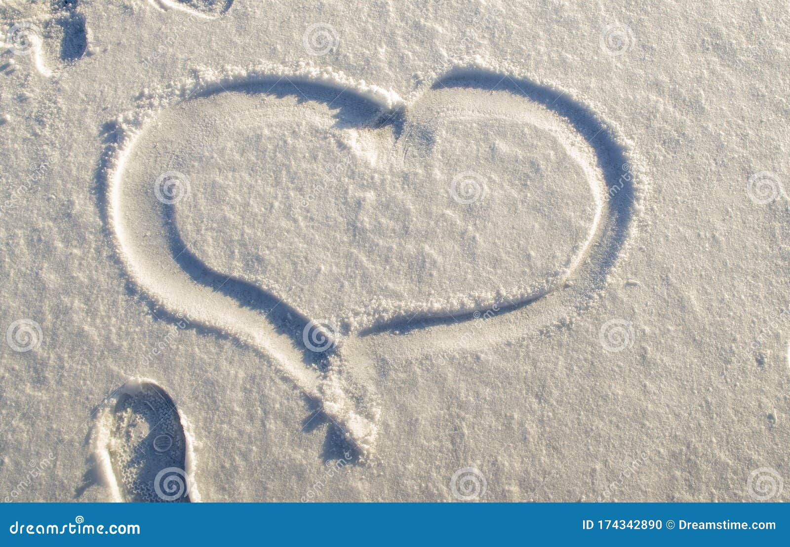 Heart in the Snow in Sunset Light Stock Photo - Image of holiday, blue ...