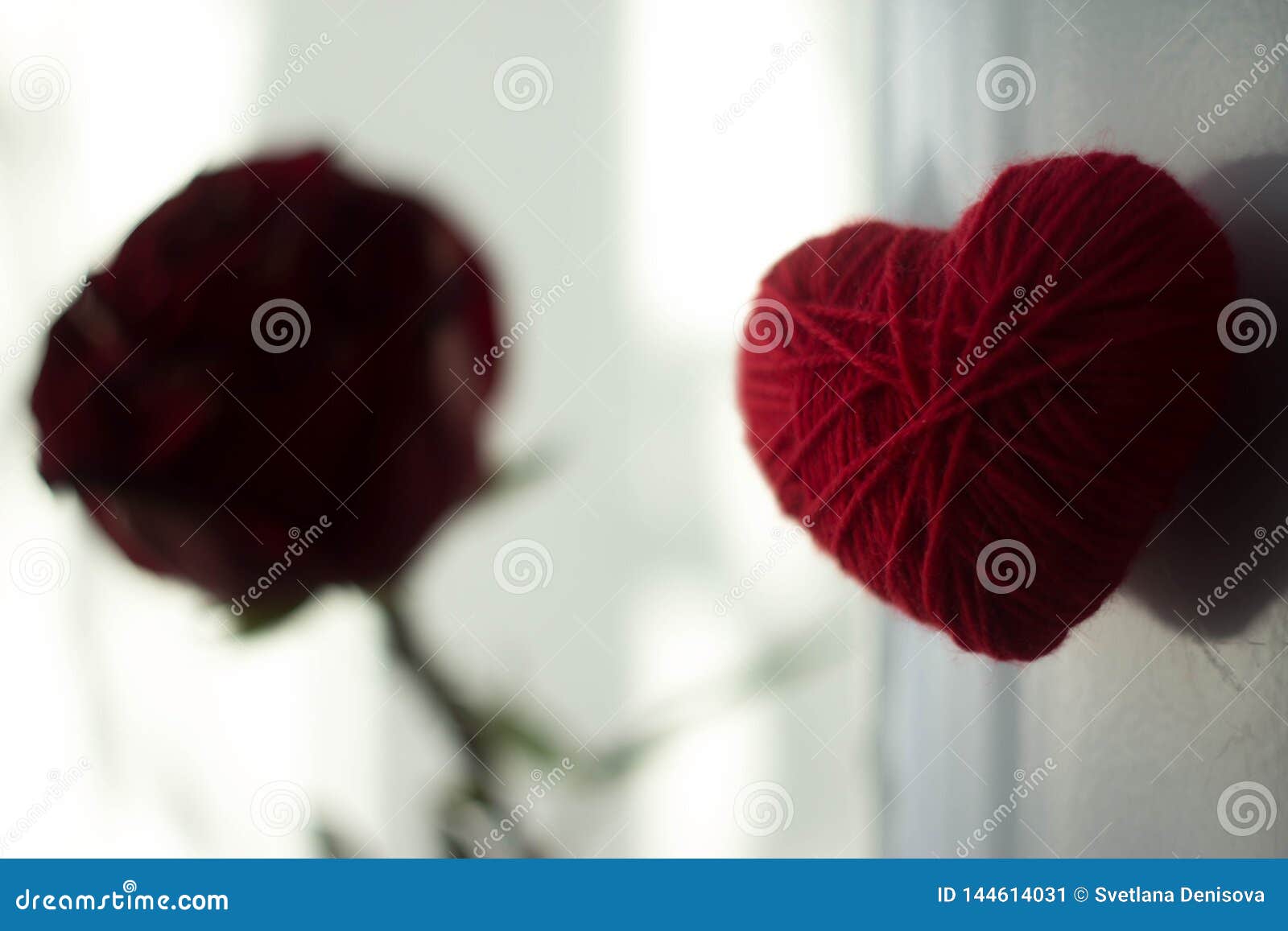 Heart of Threads Yarn on a Background of Red Roses Stock Image - Image ...