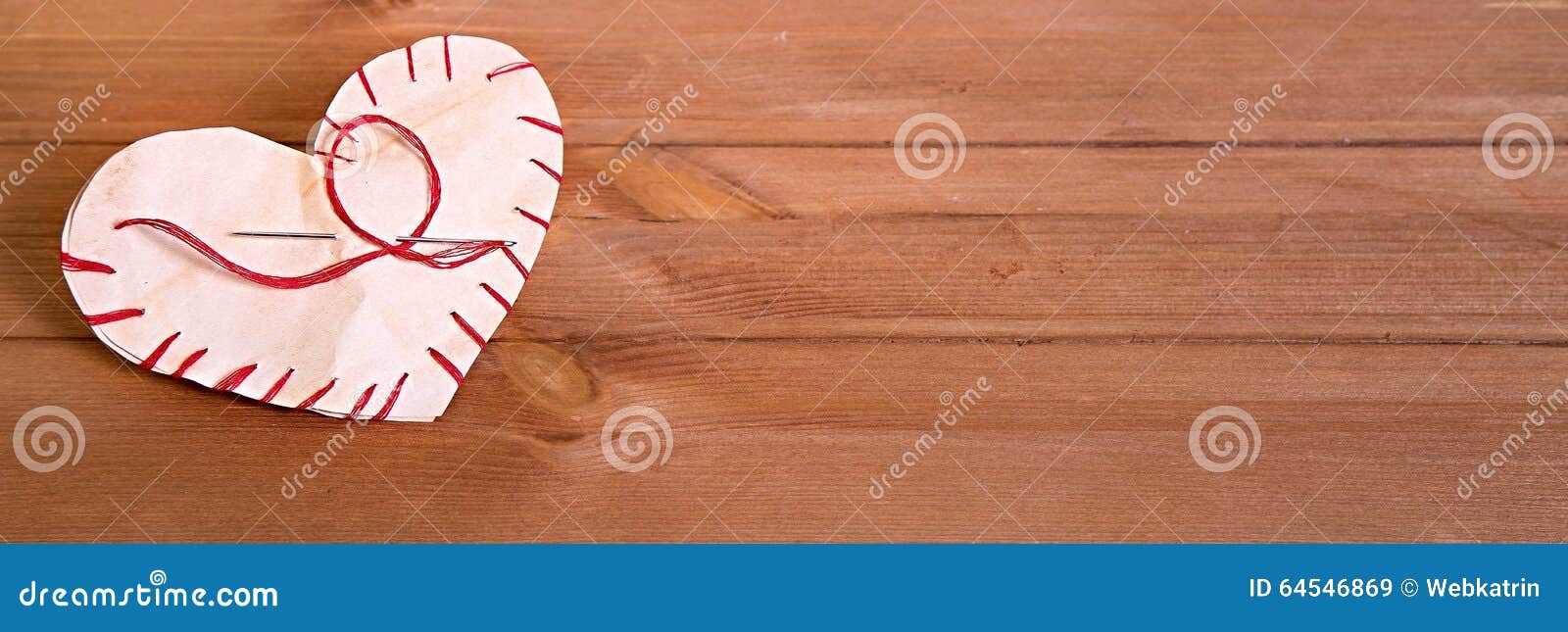The Heart Which is Cut Out from Paper and Sewed by a Red Thread Stock ...