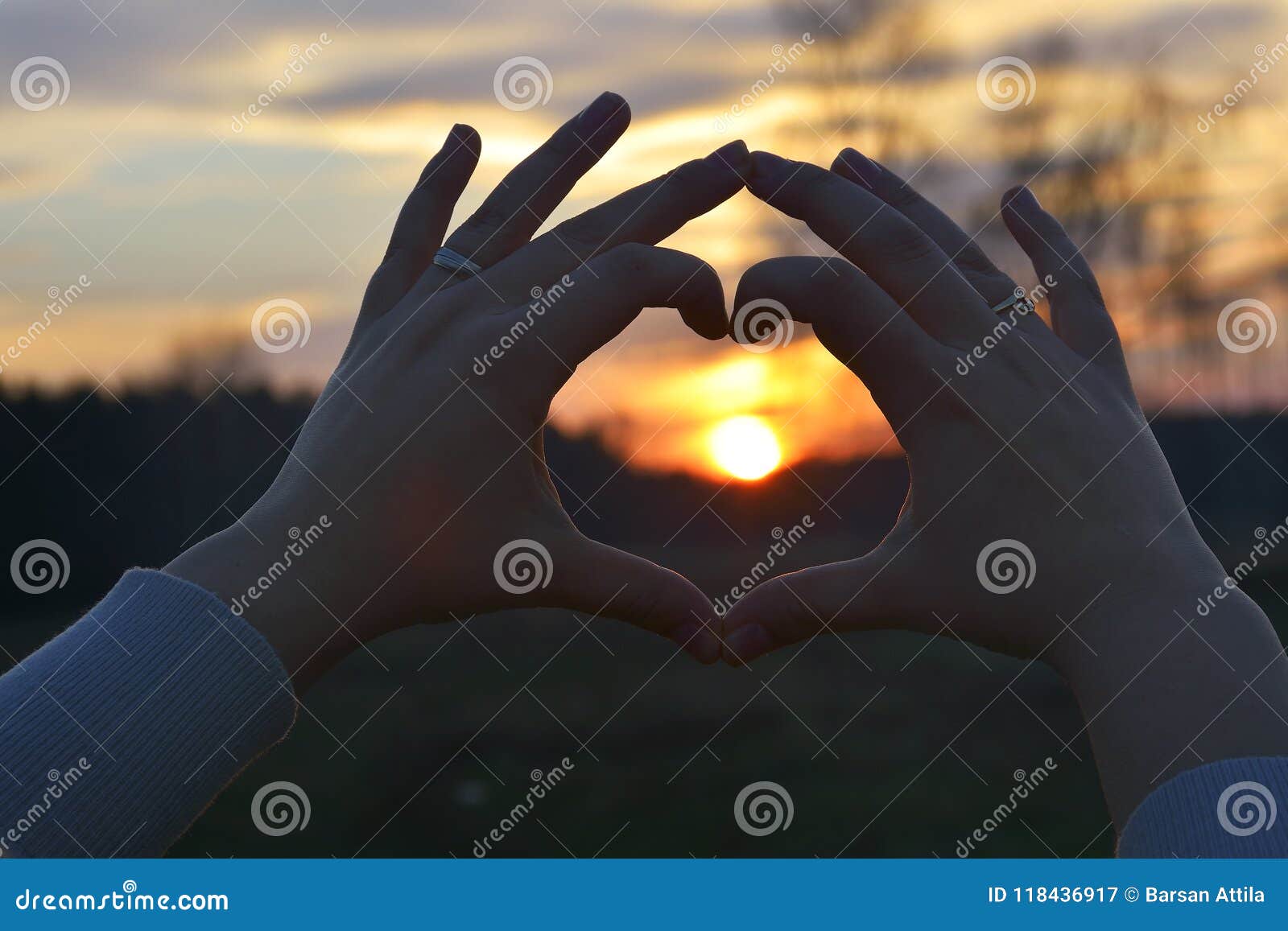 The Hearth Symbol in Sunset Stock Image - Image of person, couple ...