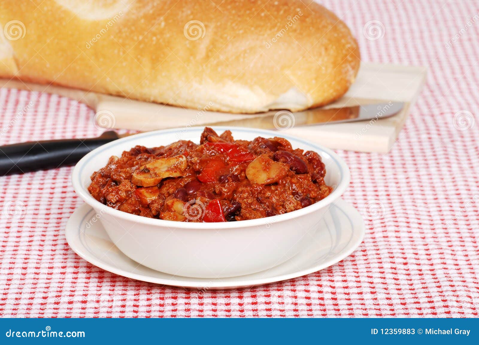 Hearty Chili with Loaf of Bread Stock Image - Image of board, diner ...