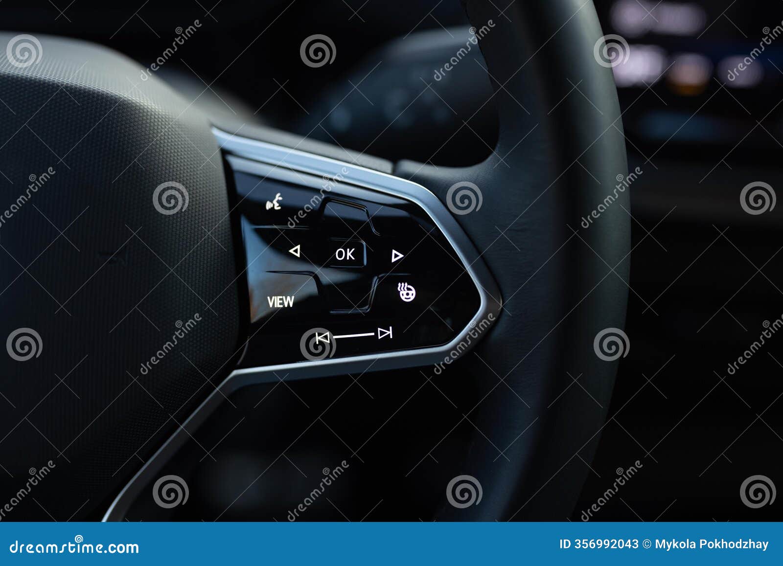 Heated Steering Wheel Control Buttons with Blurred Dashboard in Car ...