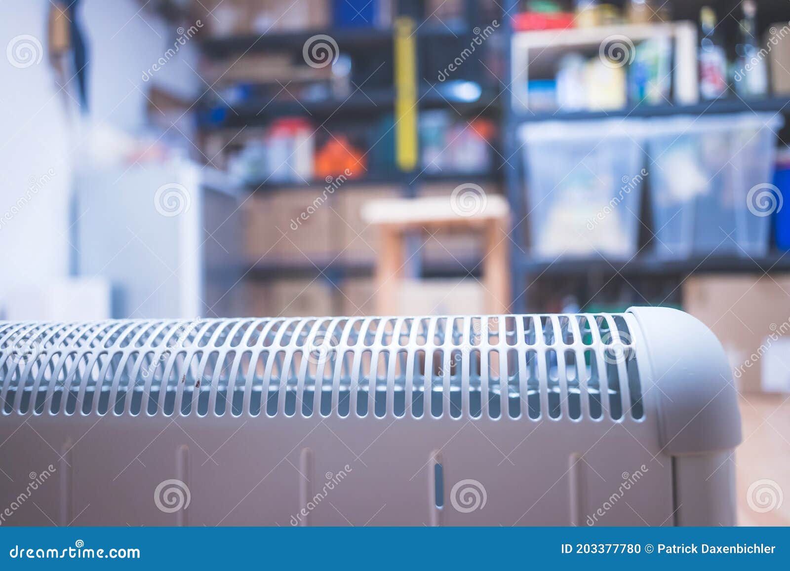 Heating the Basement with Electric Heater. Blurry Boxes and Shelfs in ...